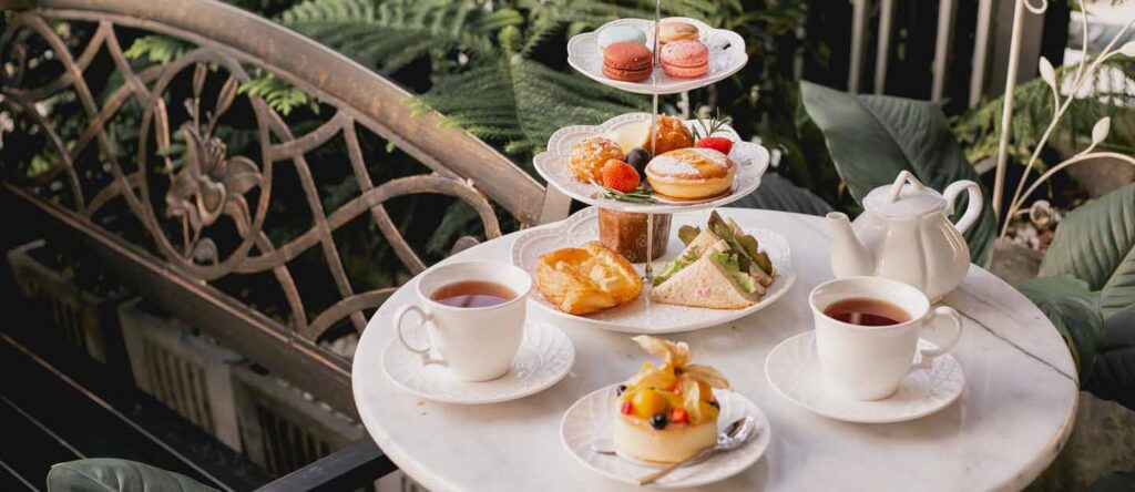 Best Places for Afternoon Tea in Dubai: QE2, Raffles & More - MyBayut